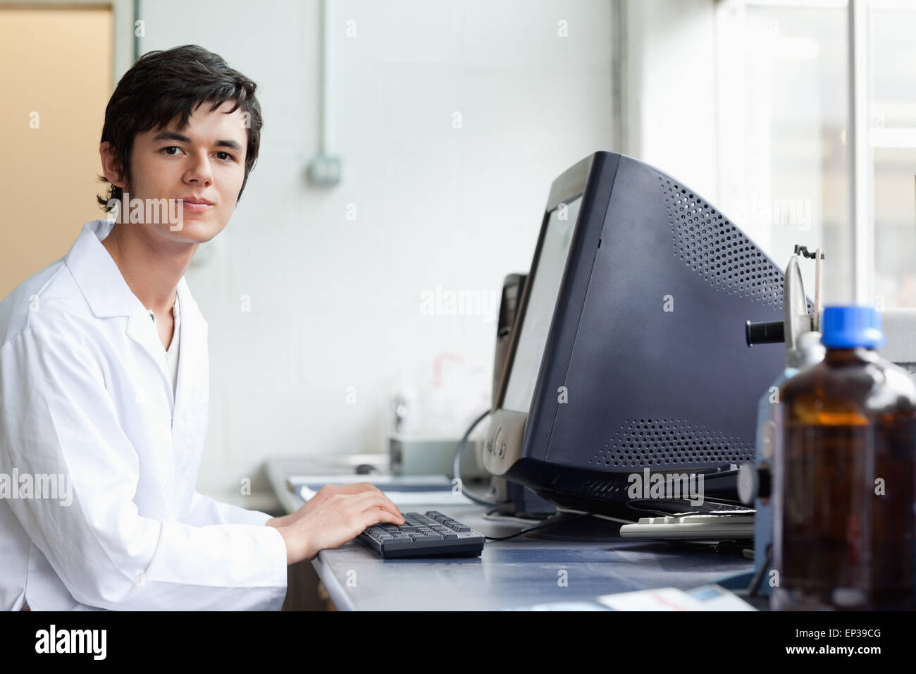 Student posing with a monitor Stock Photo - Alamy