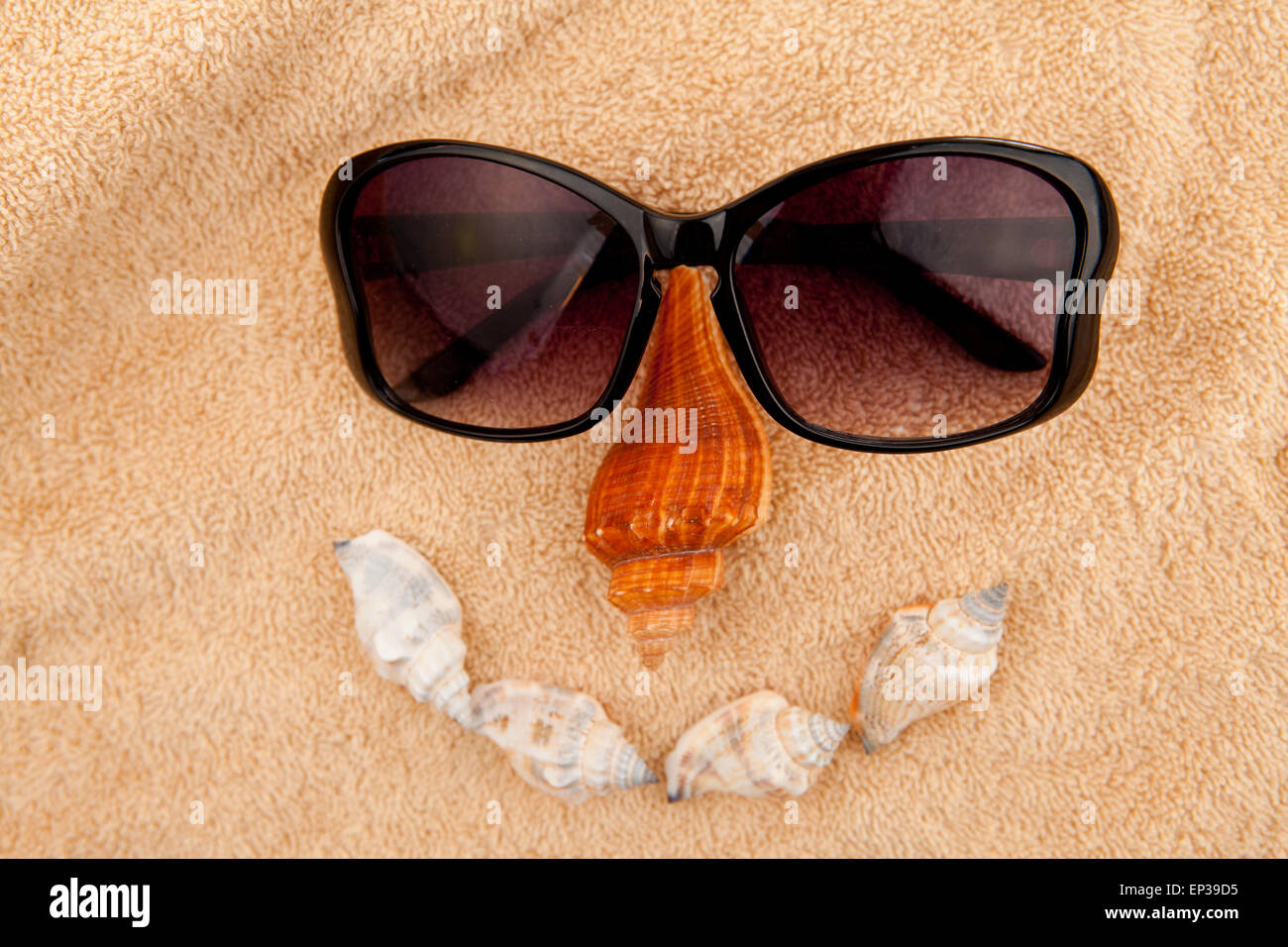 Shellfishes and sunglasses representing a face Stock Photo - Alamy