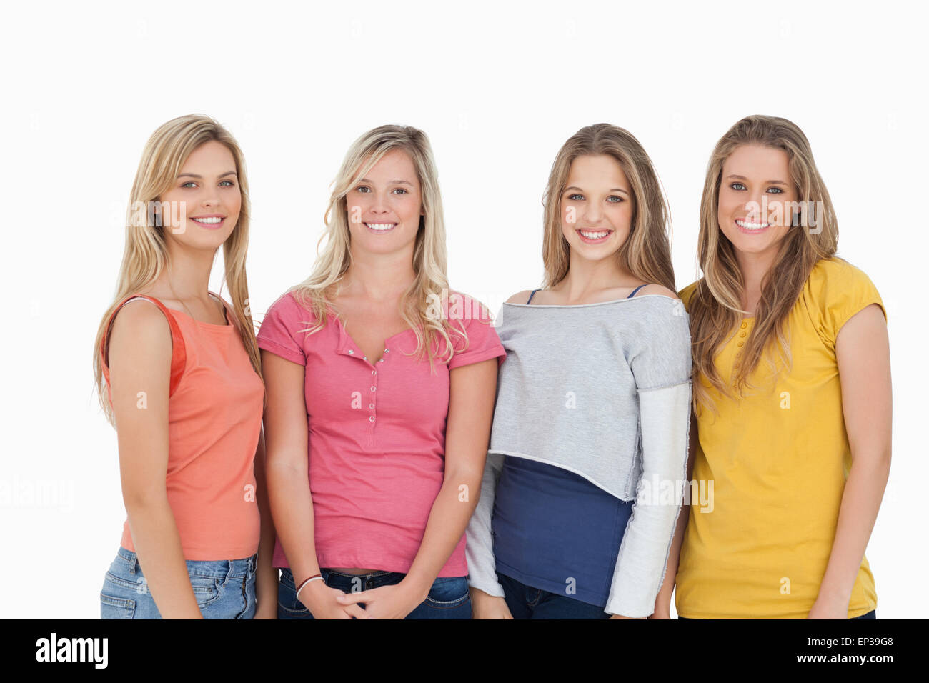 Four girls smiling as they look at the camera Stock Photo - Alamy