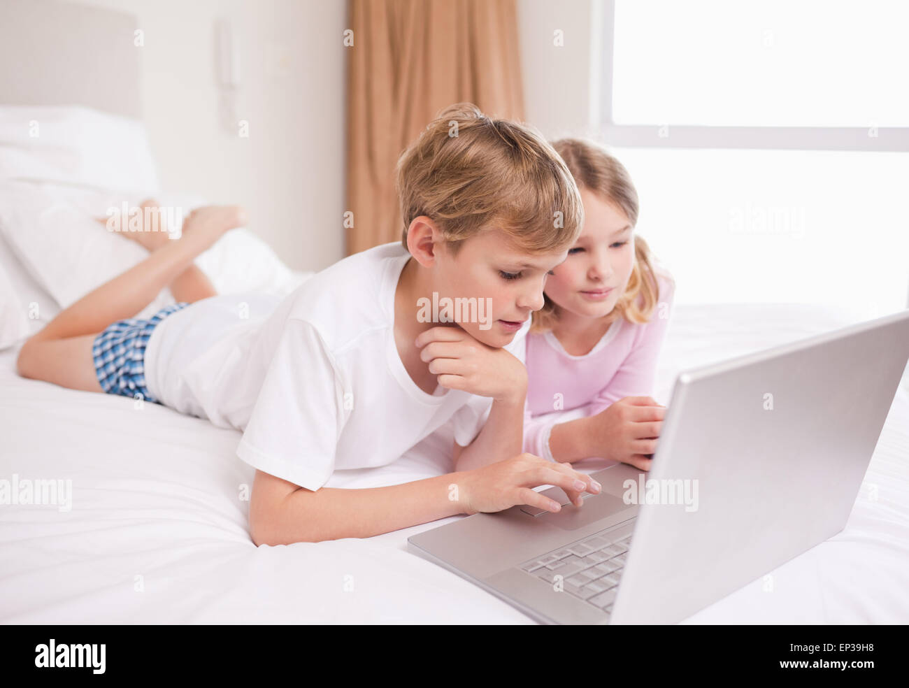 Children using a notebook Stock Photo - Alamy