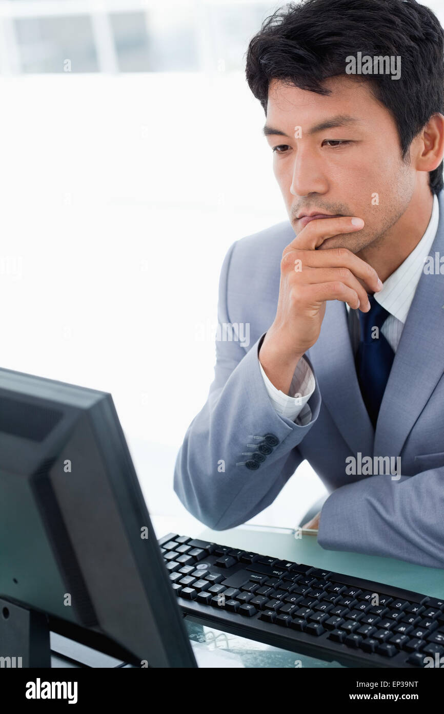 Portrait of an office worker using a monitor Stock Photo - Alamy