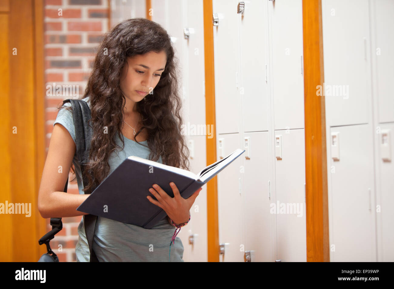 Student reading a book Stock Photo - Alamy