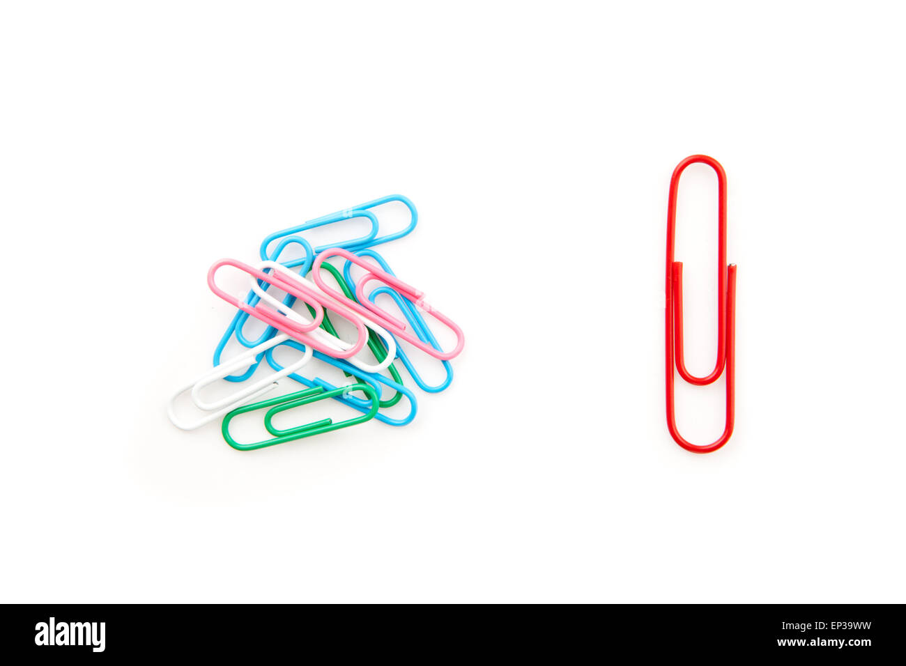 Big red paper clip and many paper clips side by side Stock Photo - Alamy