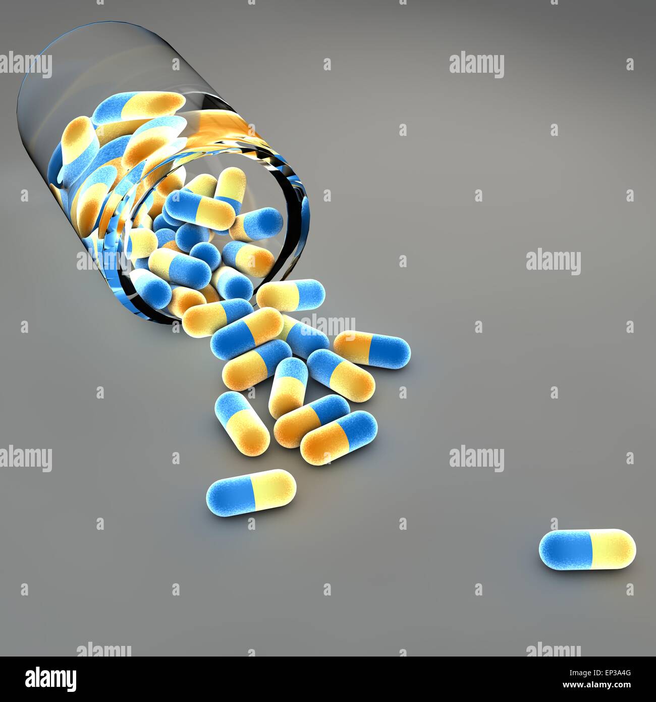 Spilled yellow and blue pills with bottle on gray background Stock ...