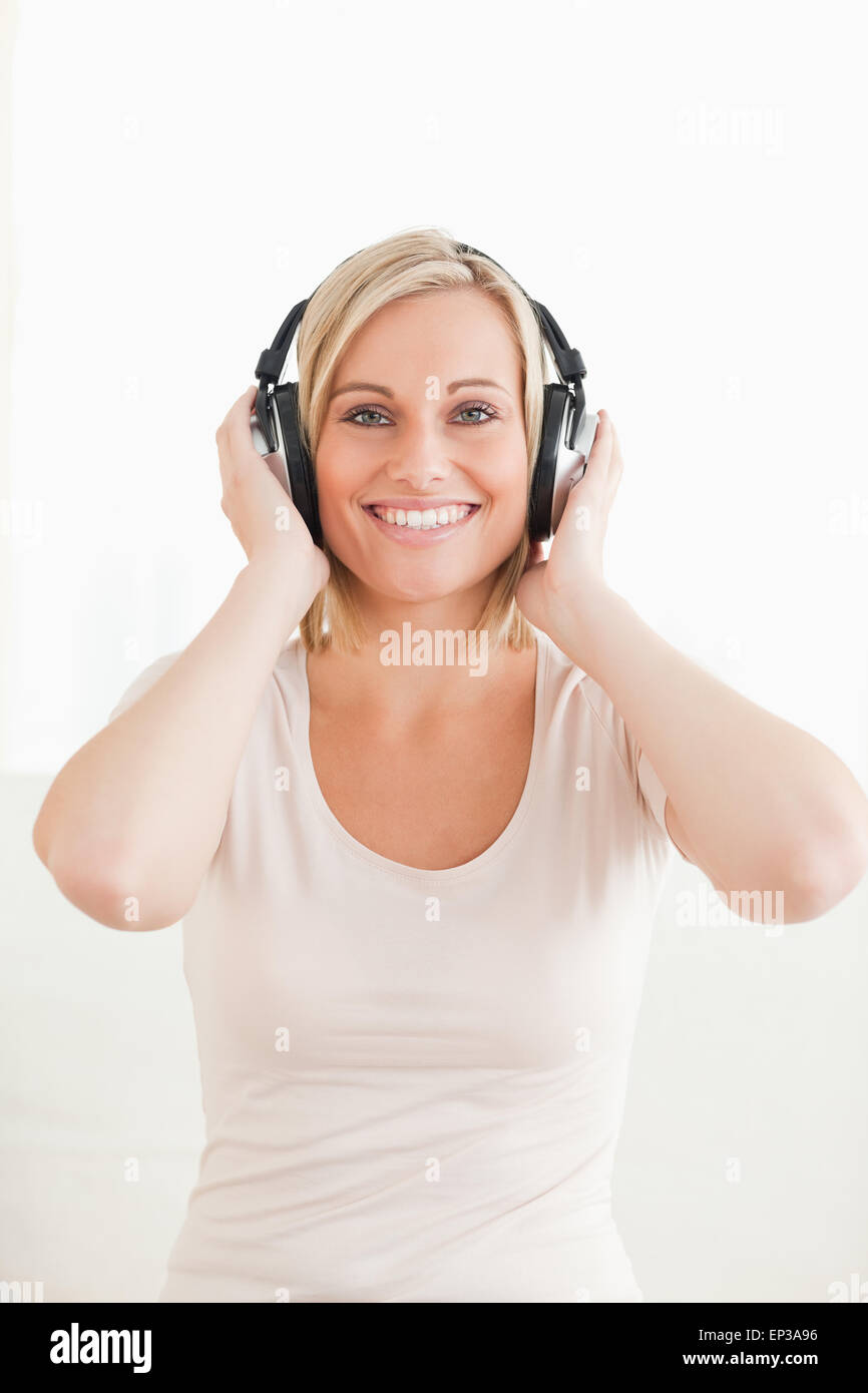 Portrait of a lovely woman enjoying some music Stock Photo - Alamy