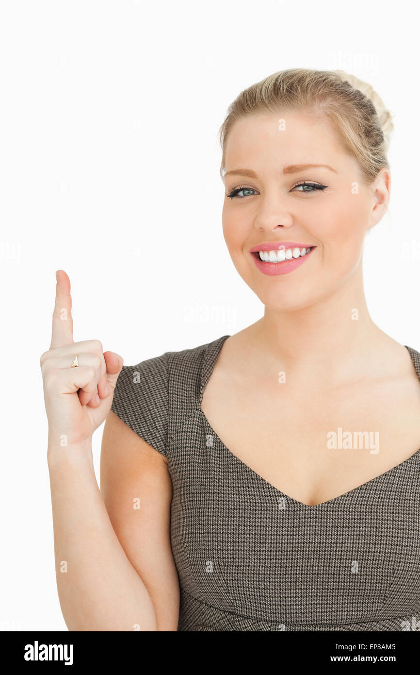Pretty woman pointing something with her finger Stock Photo - Alamy