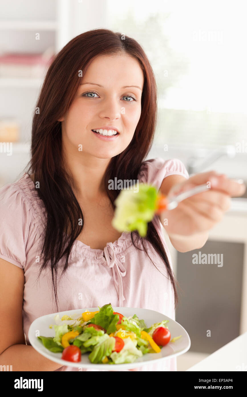 Woman offering salad Stock Photo - Alamy