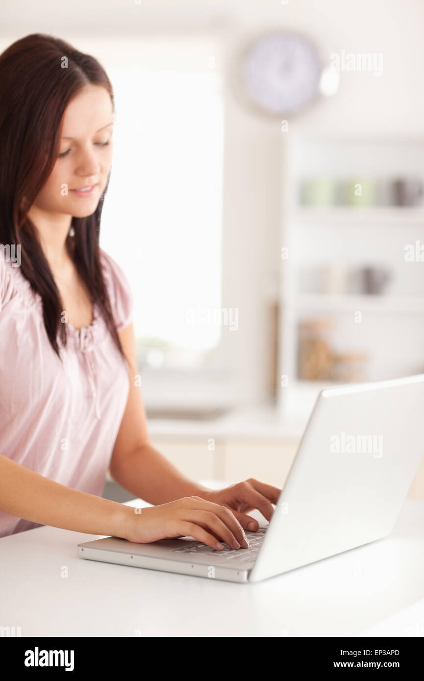 Woman typing on laptop Stock Photo - Alamy