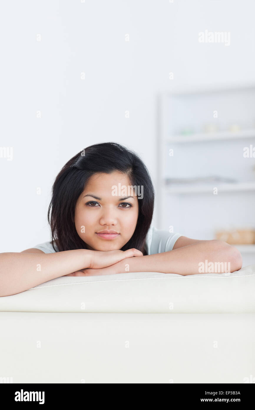 Woman crossing her arms and resting her head on them Stock Photo - Alamy