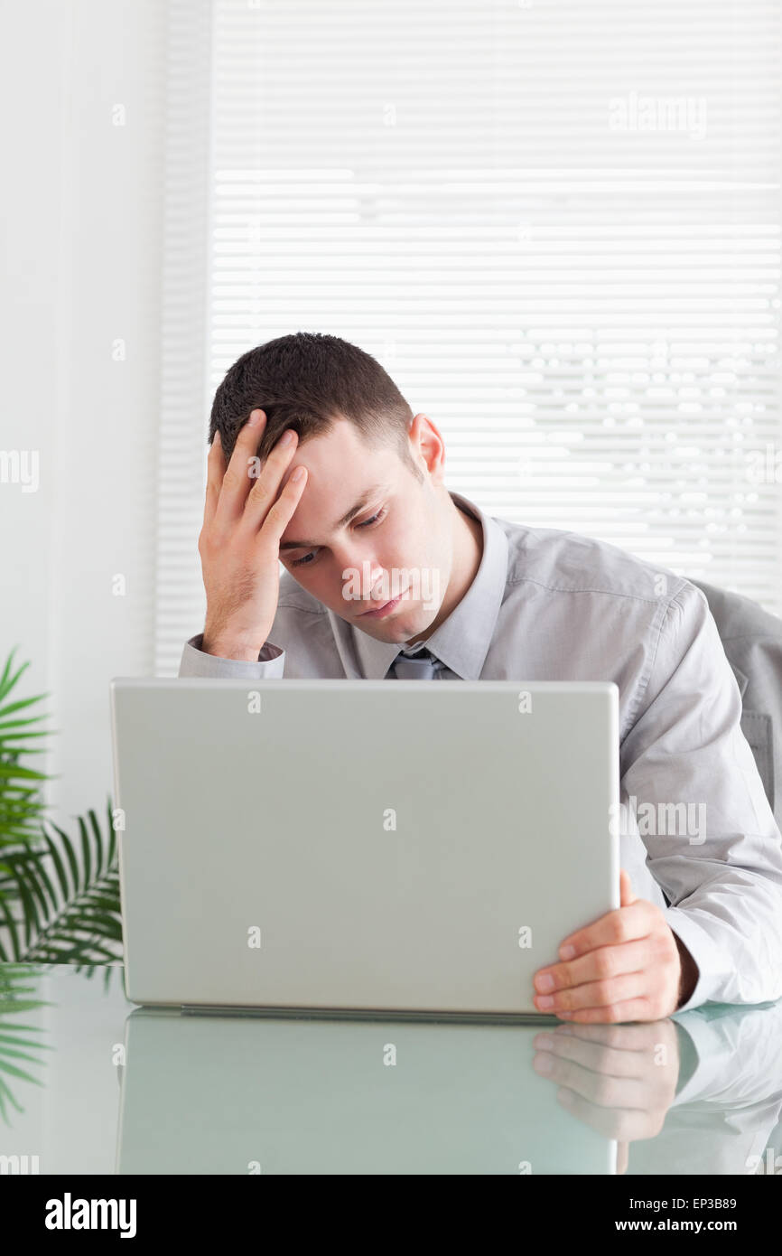 Sad looking men sitting table hi-res stock photography and images - Alamy