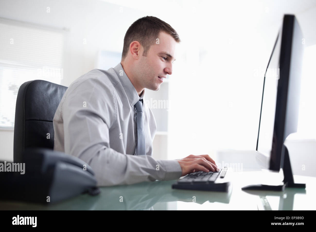 Businessman working concentrated on his computer Stock Photo - Alamy