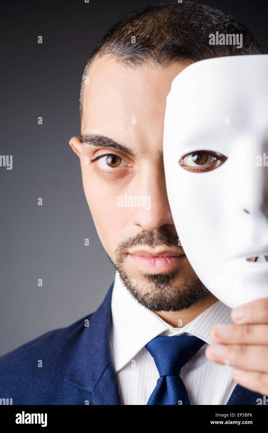 Man with masks in hypocrisy concept Stock Photo - Alamy