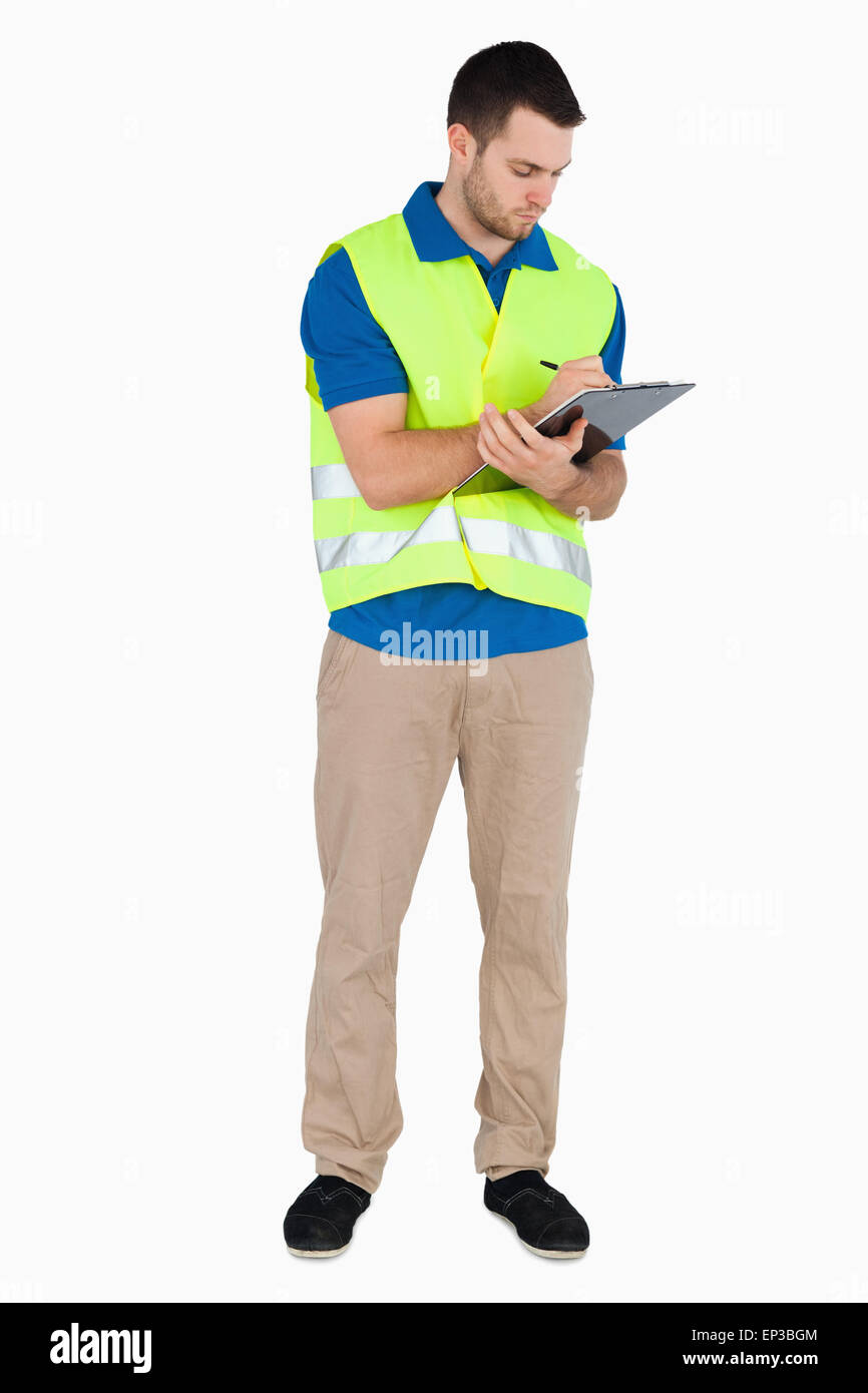 Young male with safety jacket taking notes Stock Photo - Alamy