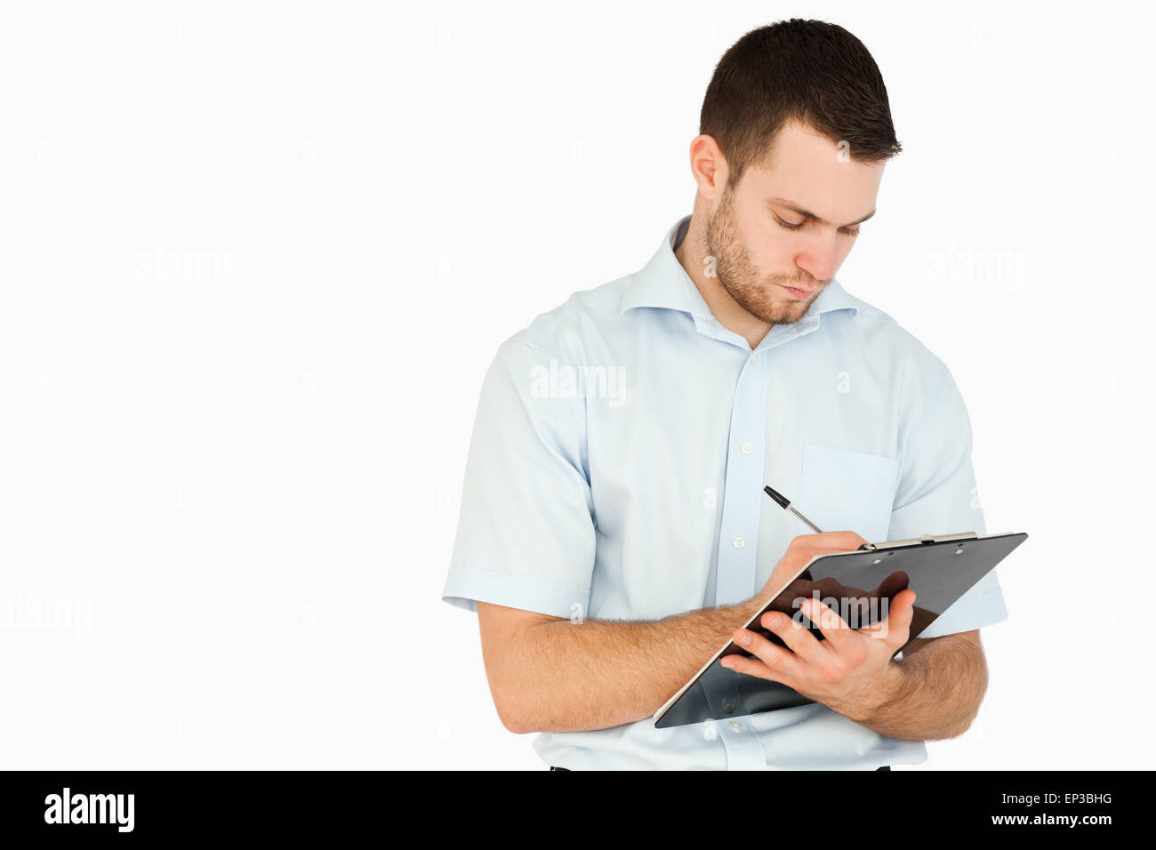 Young post employee taking notes Stock Photo - Alamy