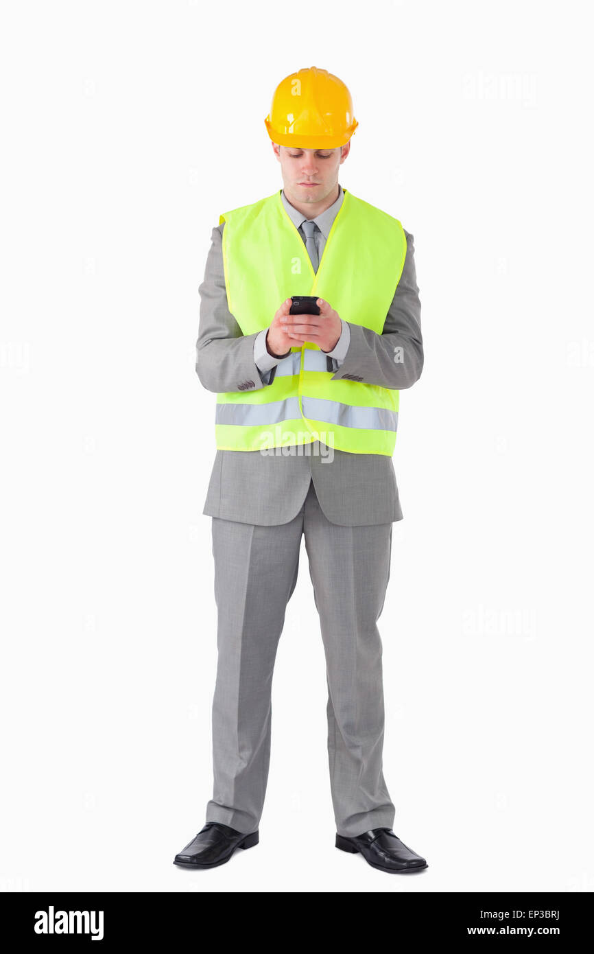 Portrait of a young builder using his cellphone Stock Photo - Alamy