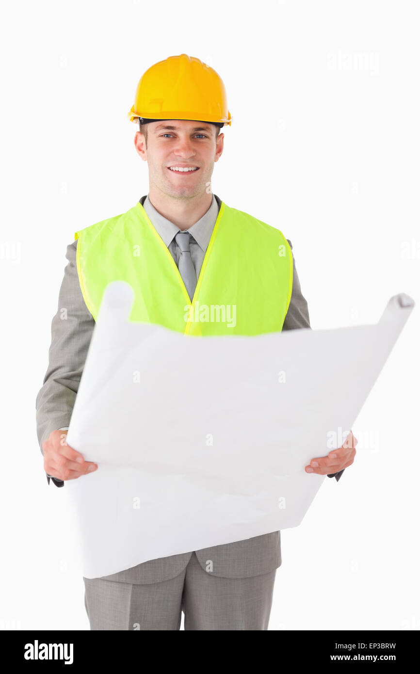 Portrait of a builder looking at a plan Stock Photo - Alamy