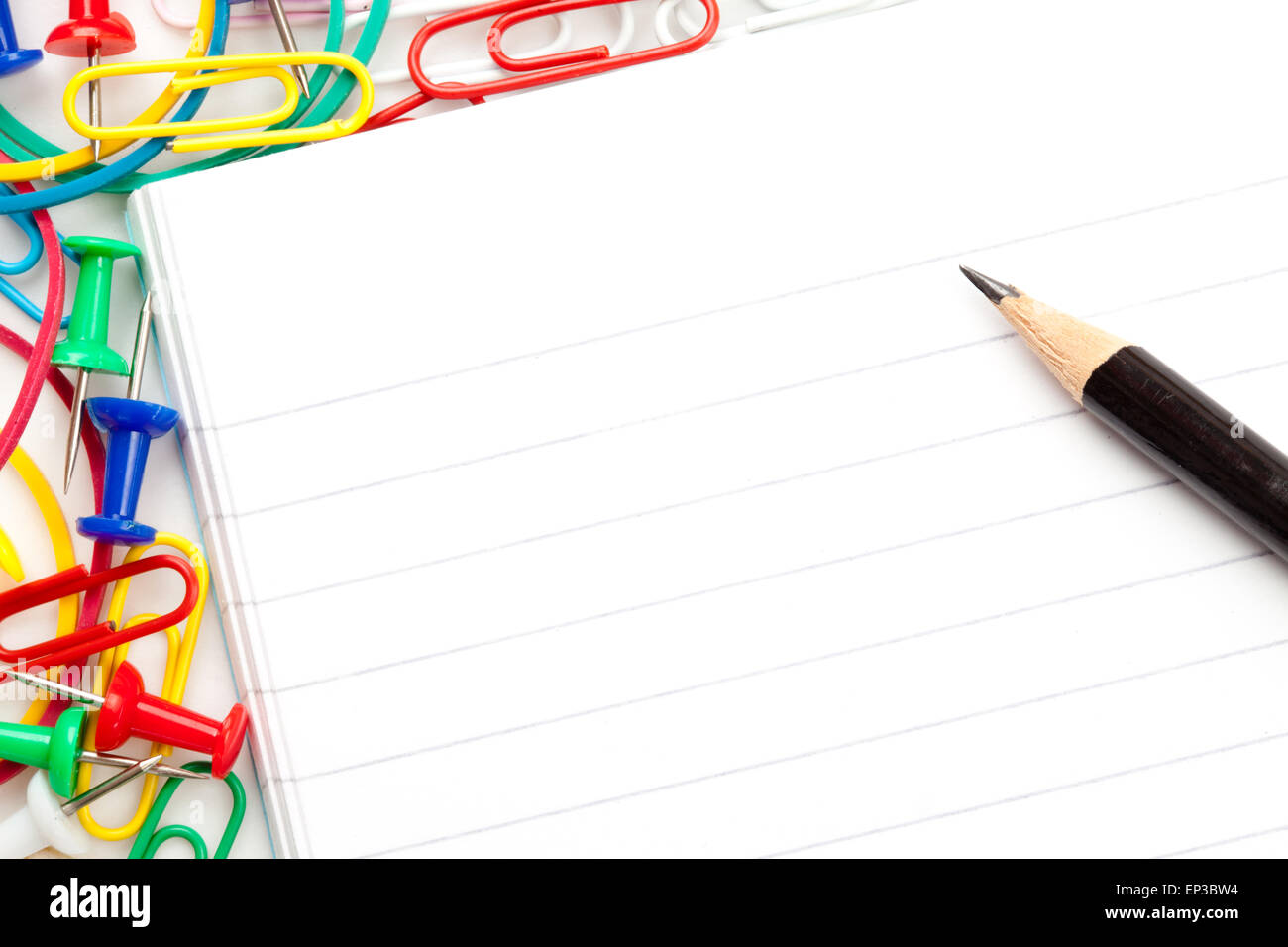 Notepad with large group of muti coloured stationery and a pencil Stock ...