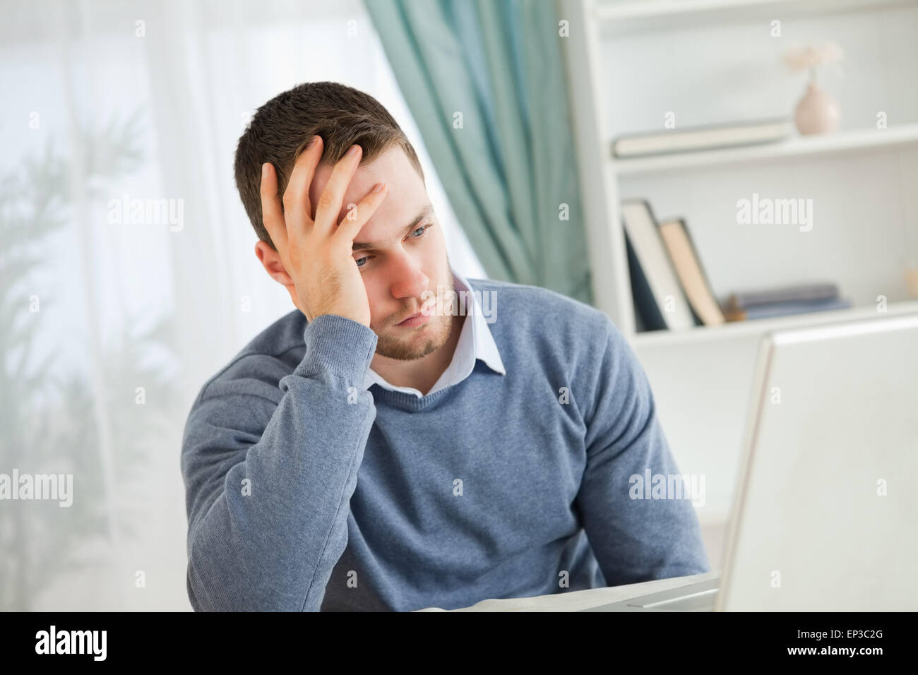 Tired man on his laptop Stock Photo - Alamy