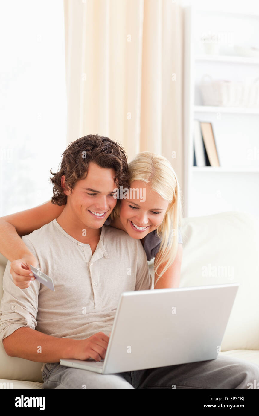 Portrait of a couple purchasing online Stock Photo - Alamy