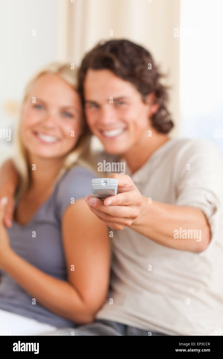 Portrait of a young couple watching TV Stock Photo - Alamy