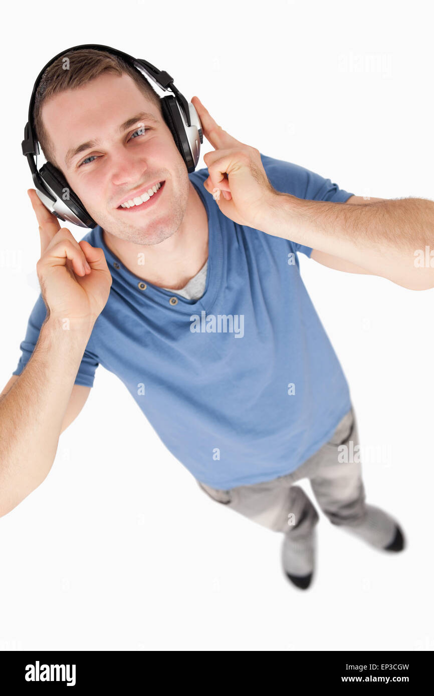 Portrait of a young man listening to music Stock Photo - Alamy