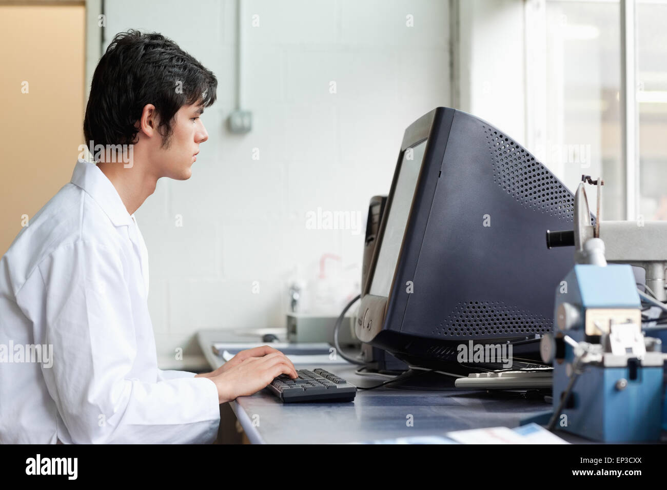 Student working with a monitor Stock Photo - Alamy
