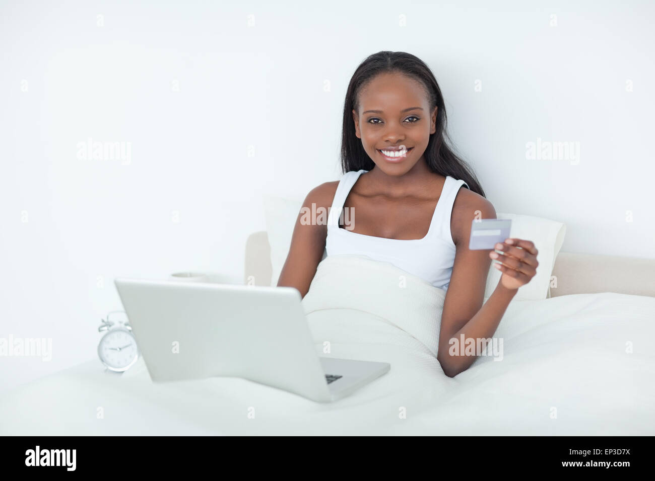 Cute woman booking her holidays online Stock Photo - Alamy