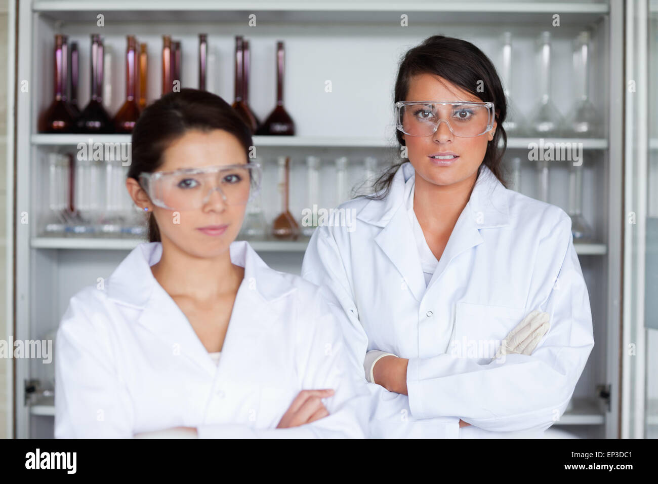 Serious female science students posing Stock Photo - Alamy