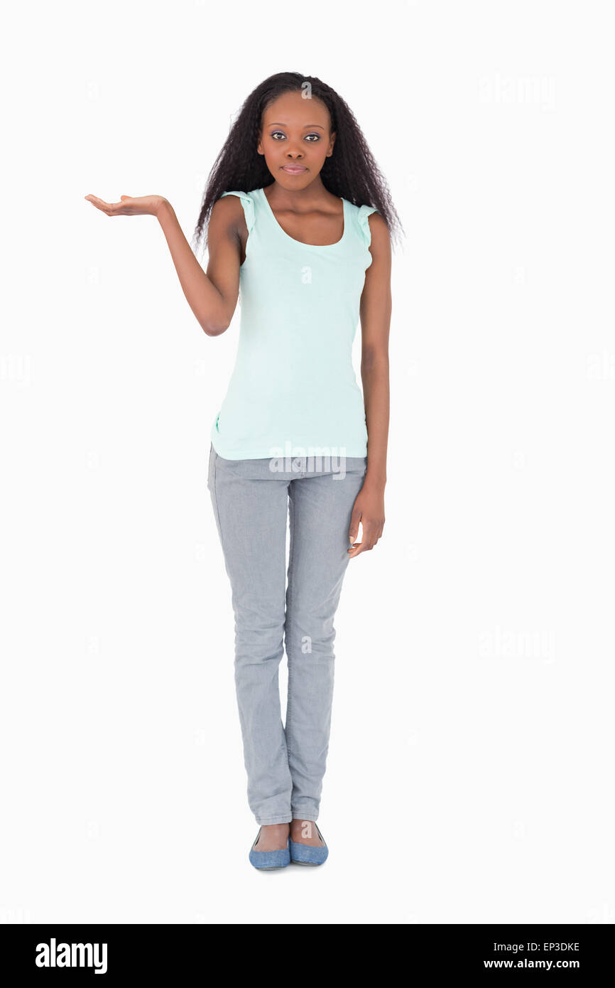 Woman presenting something on a white background Stock Photo - Alamy