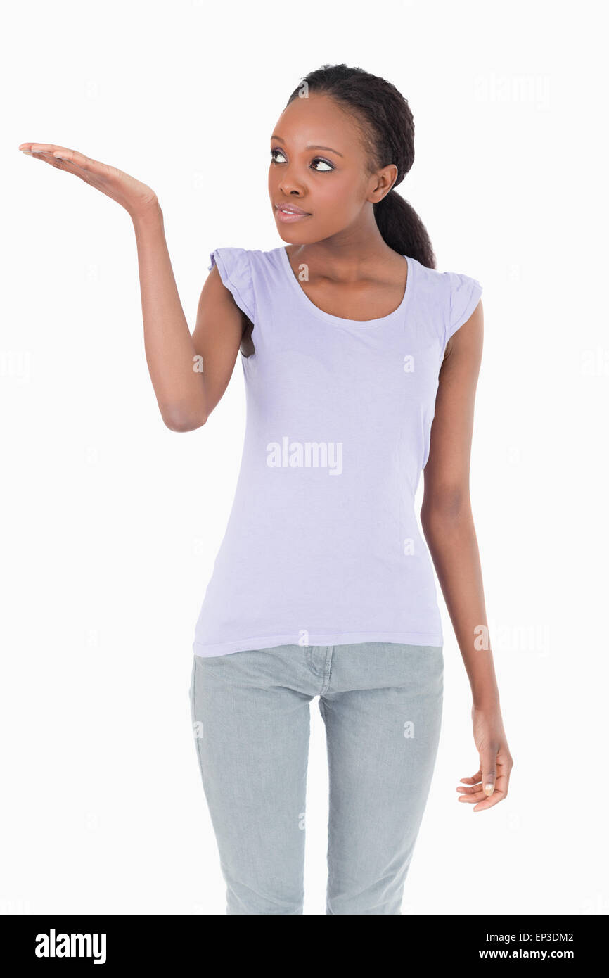 Close up of woman presenting something on white background Stock Photo ...