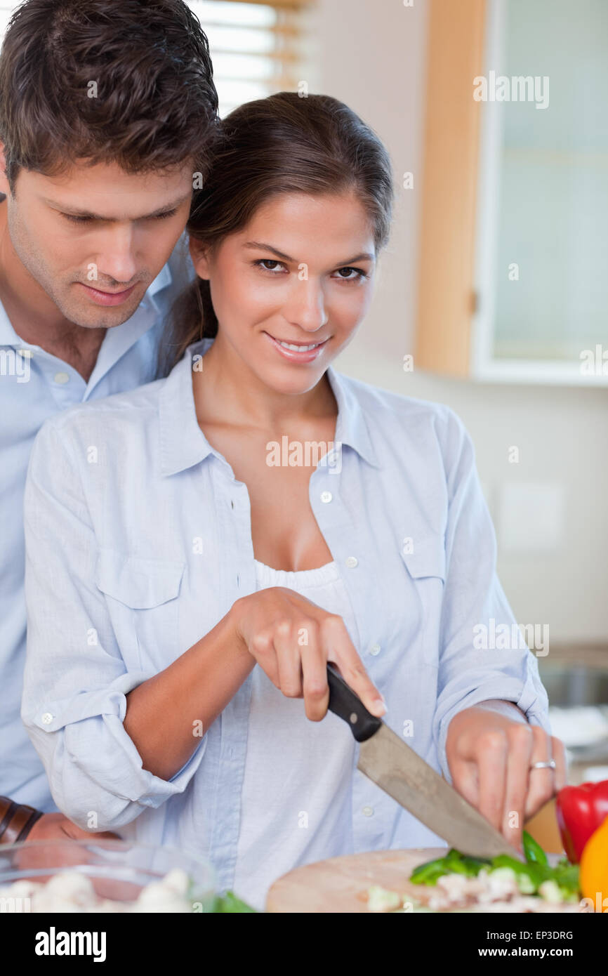 Portrait of a young couple cooking Stock Photo - Alamy