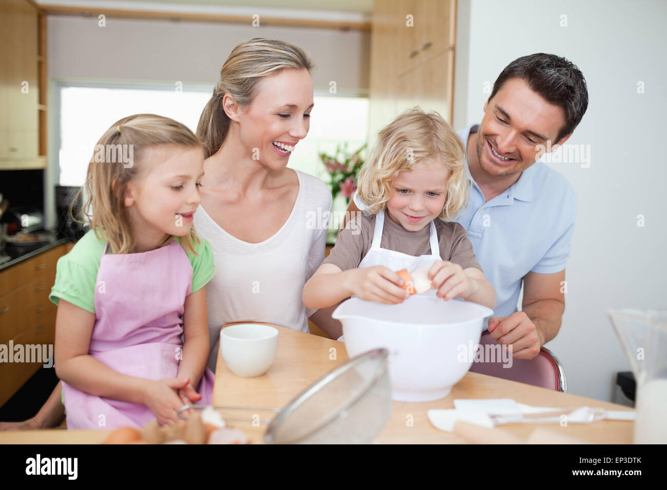 Family preparing cookies Stock Photo - Alamy