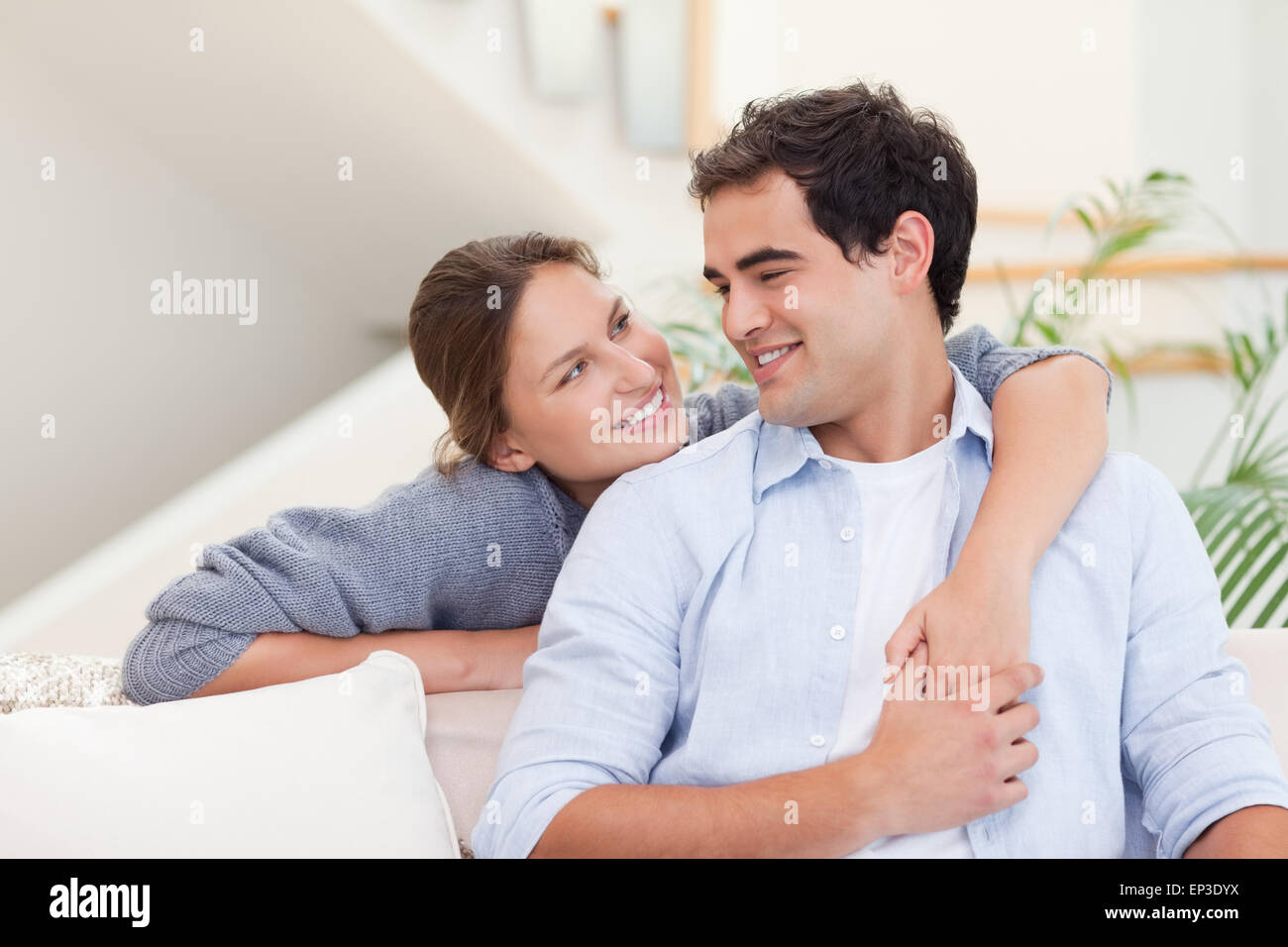 Smiling couple hugging Stock Photo - Alamy