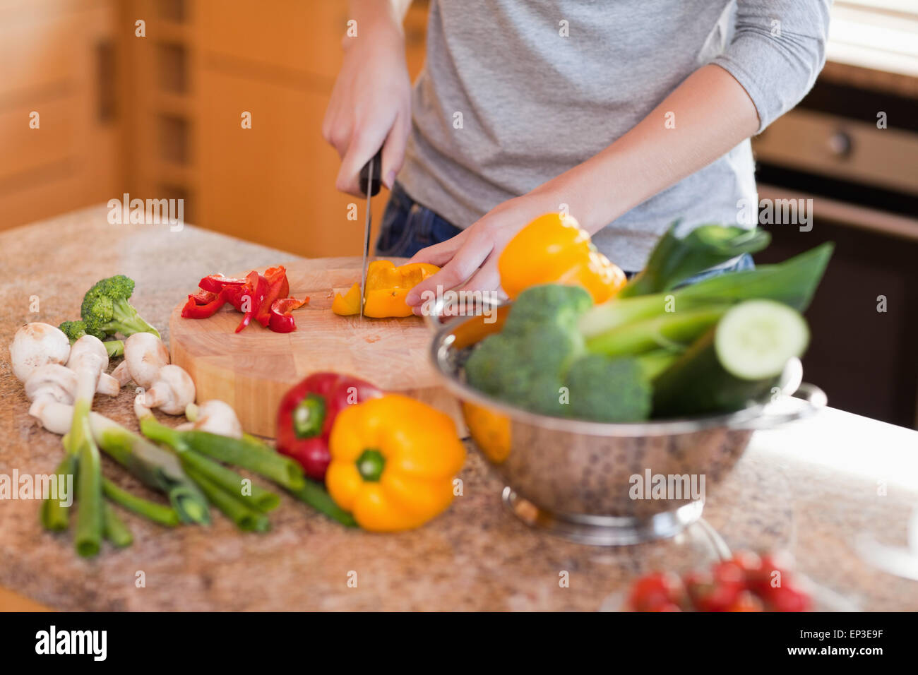Woman cutting vegetables Stock Photo - Alamy