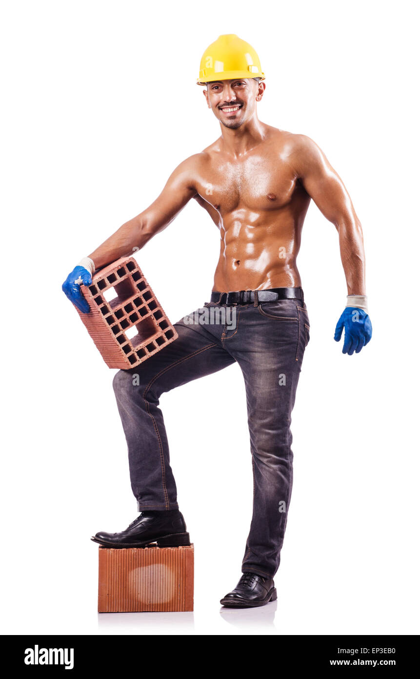 Muscular builder with bricks on white Stock Photo - Alamy