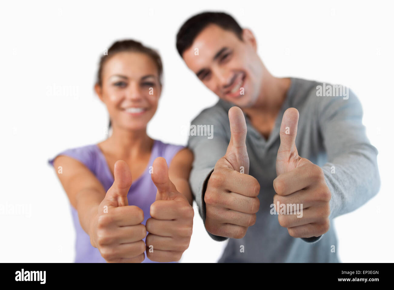Approval being given by young couple Stock Photo - Alamy
