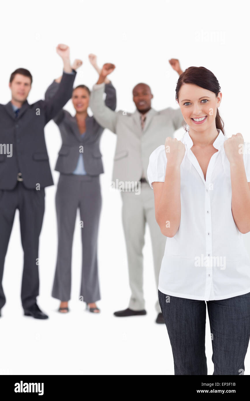 Successful businesswoman with cheering colleagues behind her Stock ...