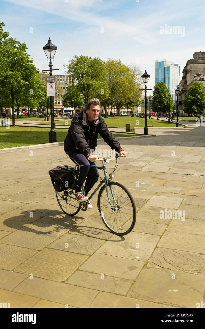 man riding a bike in Bristol Stock Photo - Alamy