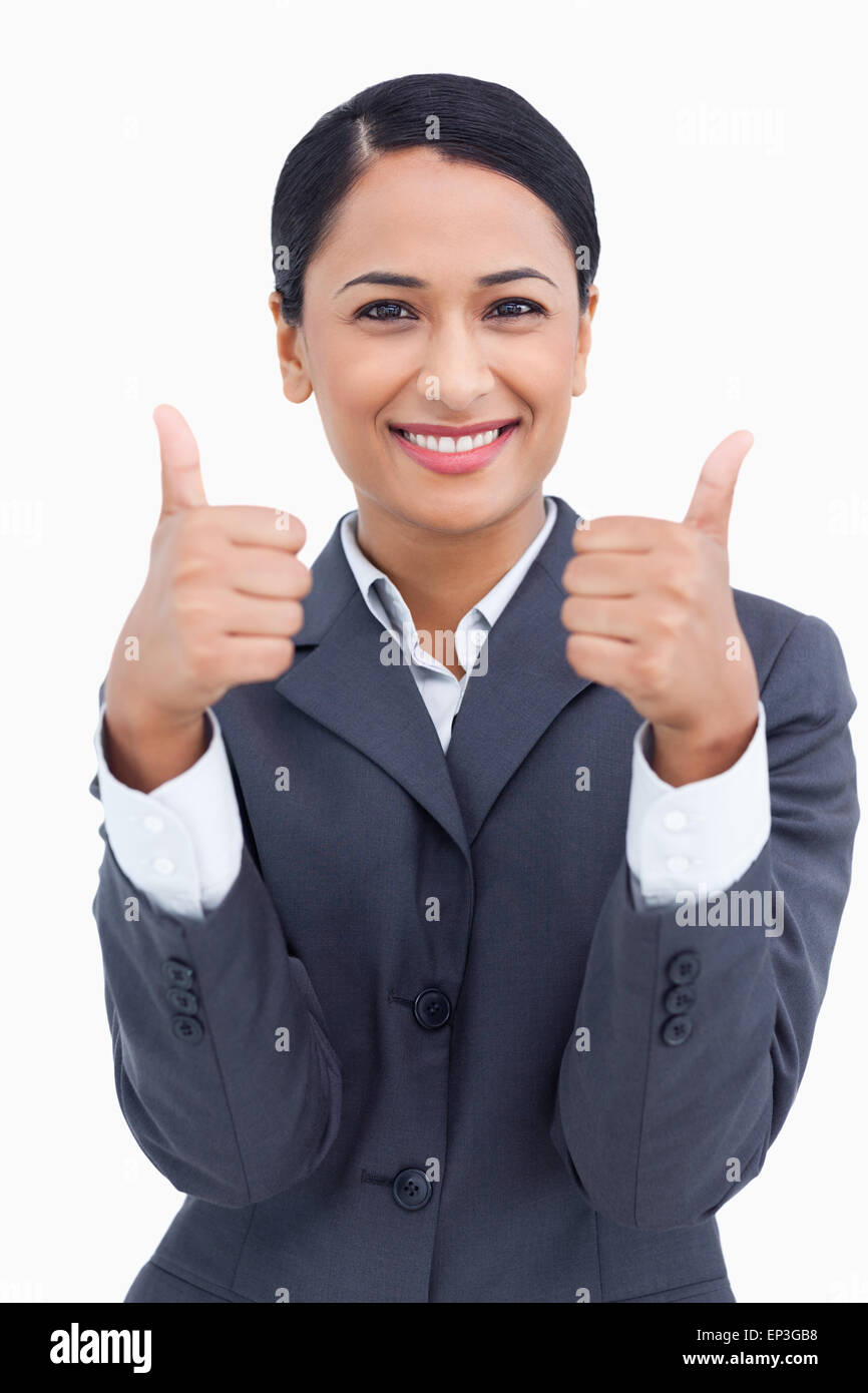 Close up of smiling saleswoman giving thumbs up Stock Photo - Alamy