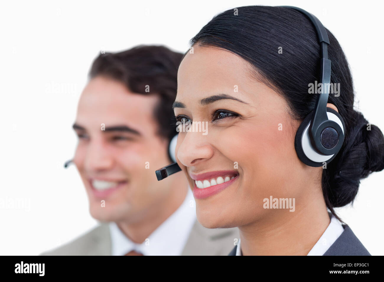 Close up side view of smiling call center agents Stock Photo - Alamy