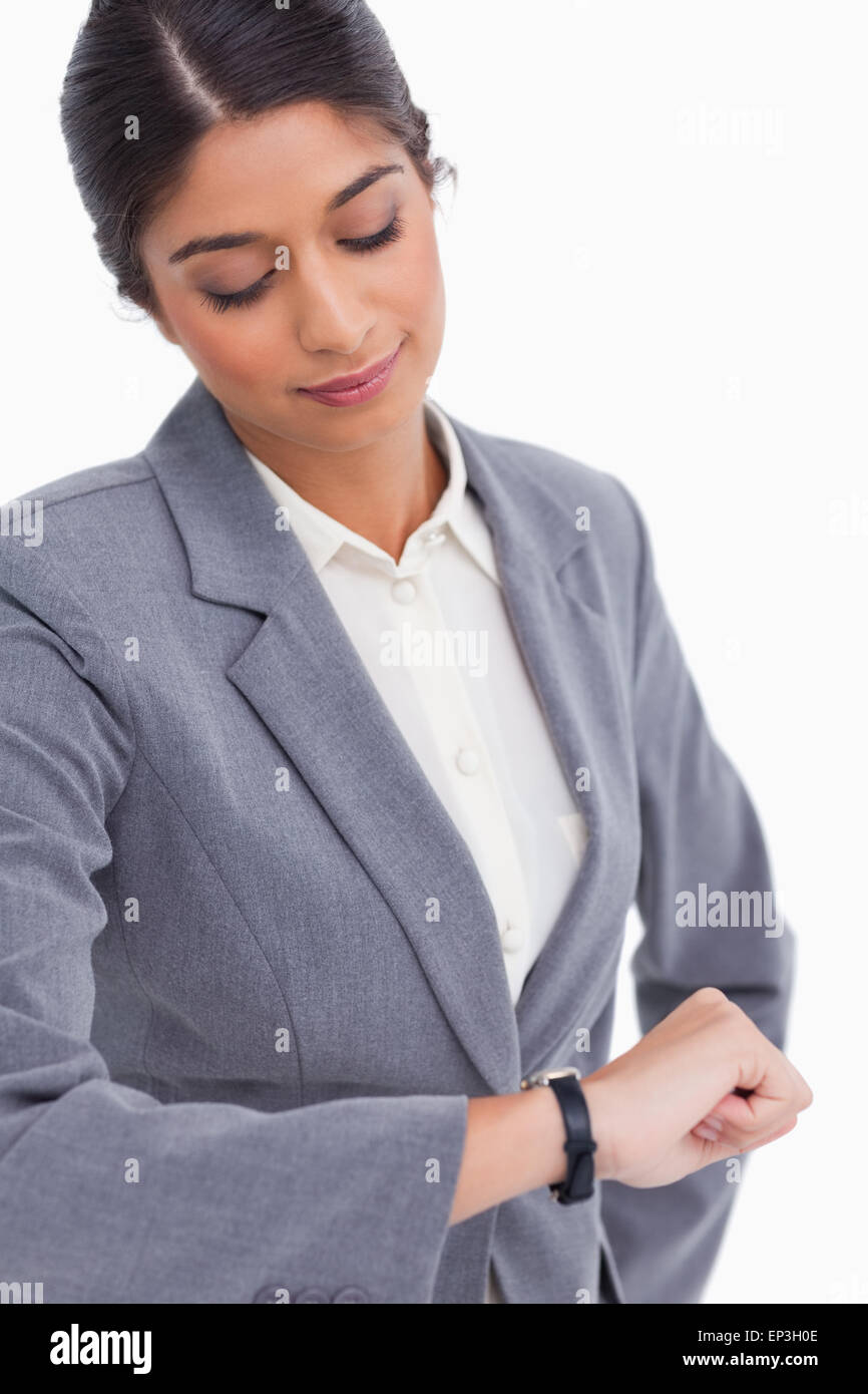 Close up of female entrepreneur looking at her watch Stock Photo - Alamy