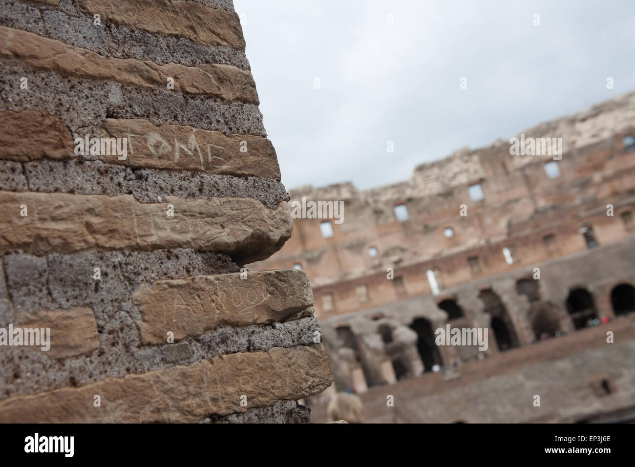 Wall with writings inside the Coliseum Stock Photo - Alamy