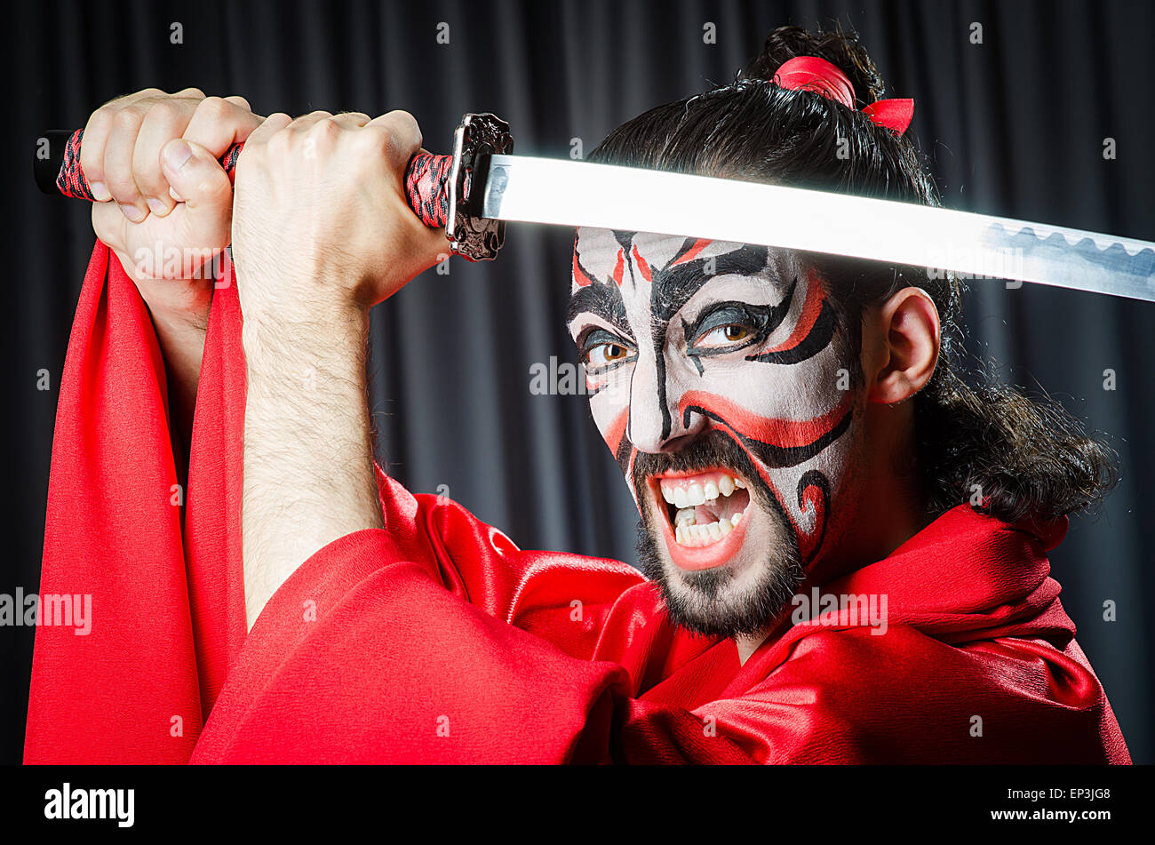 Man with sword and face mask Stock Photo - Alamy