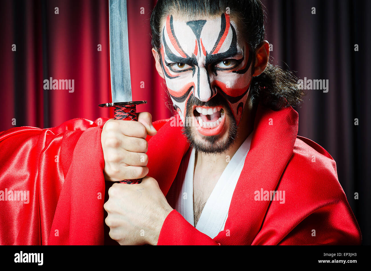 Man with sword and face mask Stock Photo - Alamy