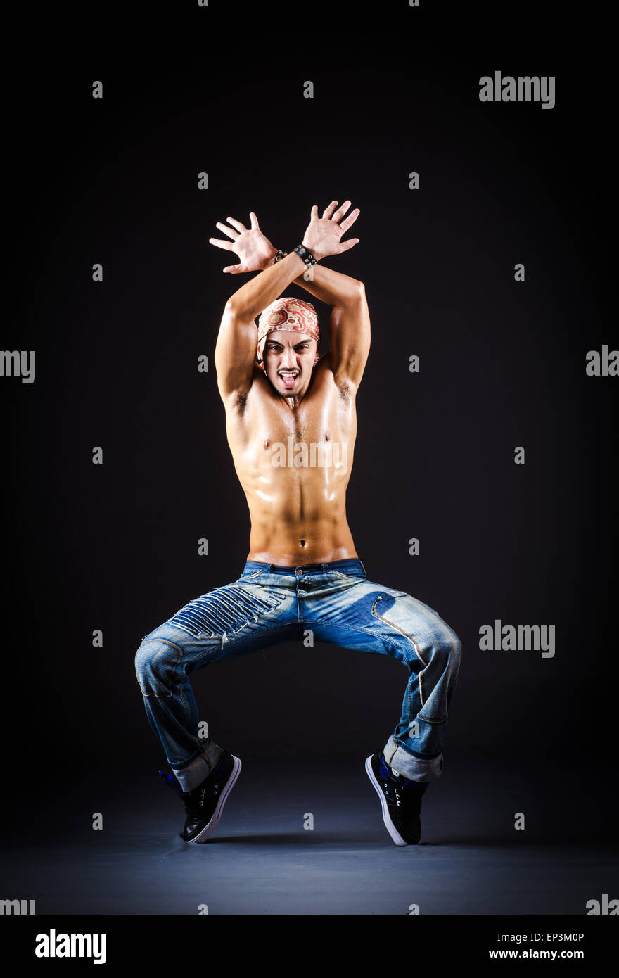Dancer dancing in dark room Stock Photo - Alamy
