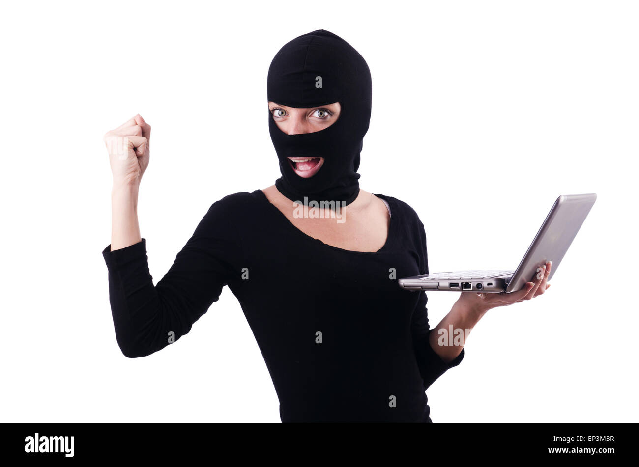 Hacker with computer wearing balaclava Stock Photo - Alamy