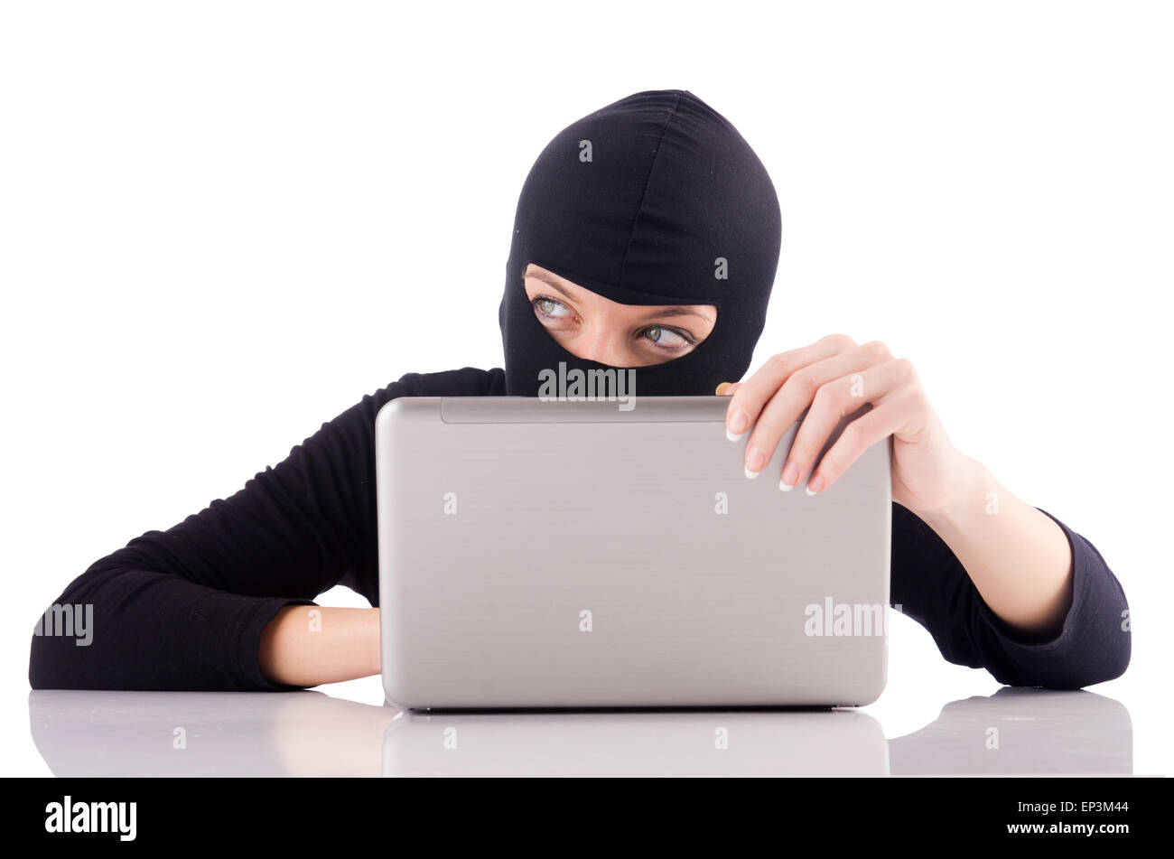 Hacker with computer wearing balaclava Stock Photo - Alamy
