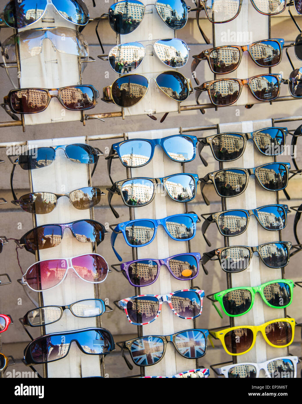 Many sunglasses on display in shop Stock Photo - Alamy
