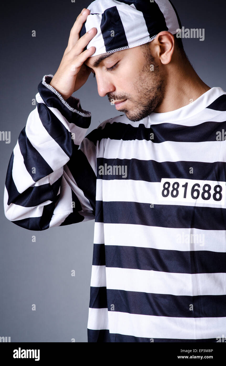 Convict criminal in striped uniform Stock Photo - Alamy