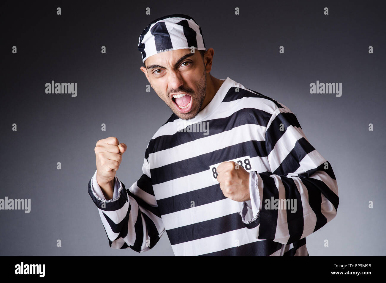 Convict criminal in striped uniform Stock Photo - Alamy